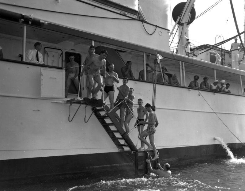 Sailors board the Williamsburg after a swim in the Caribbean Sea ...