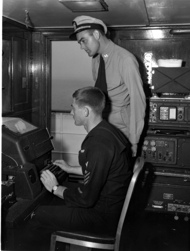 A sailor and Officer Observe the Teletype Aboard the Williamsburg | Harry S. Truman