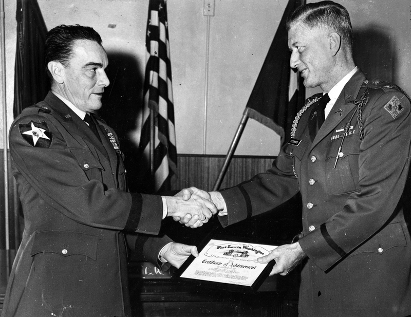 Colonel Leonard Receiving the Certificate of Achievement from Major ...