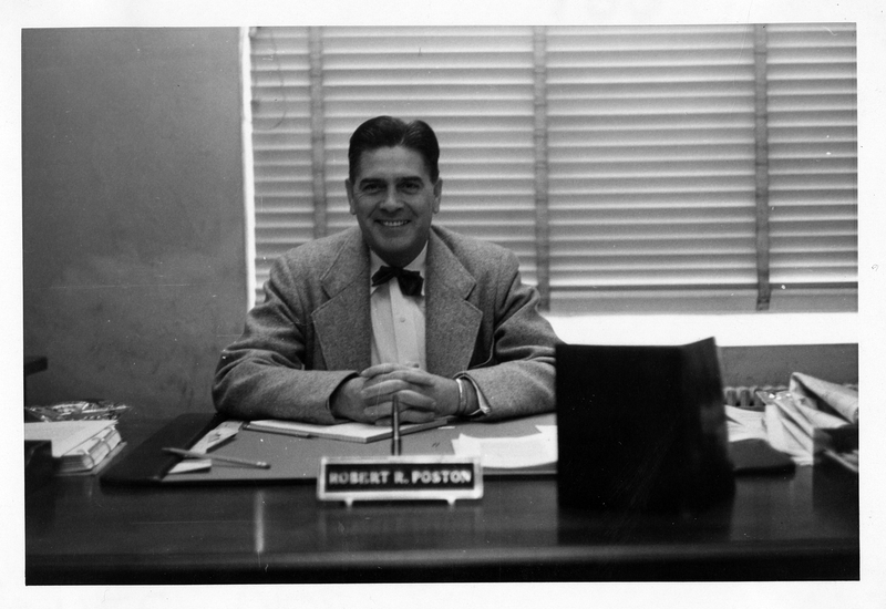 Robert E. Poston Poses at Desk | Harry S. Truman