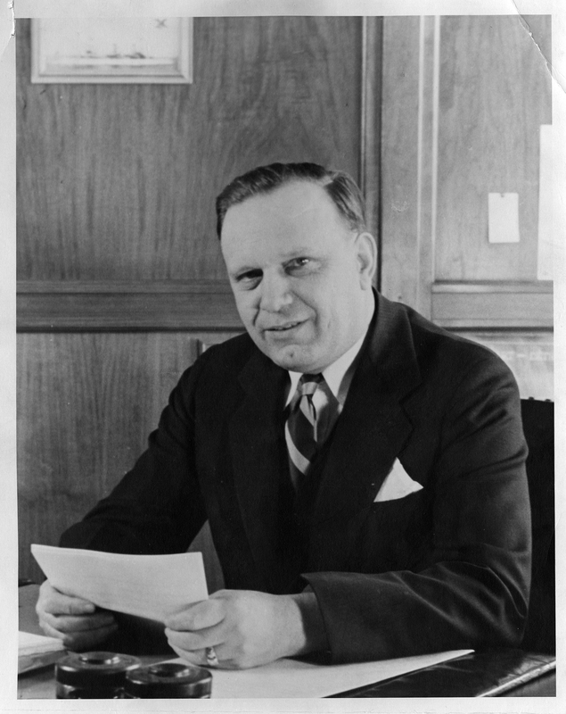 Raymond Foley Sitting at Desk | Harry S. Truman