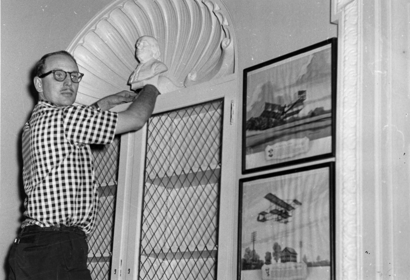 J. R. Fuchs arranging items in replica Oval Office | Harry S. Truman