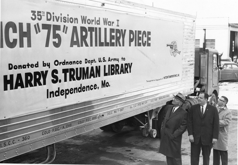 Truman and others gaze at gun viewing sign | Harry S. Truman