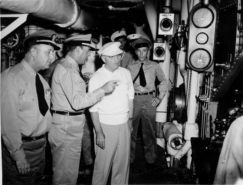 Captain Robert Dennison giving President Harry S. Truman a tour of the ...