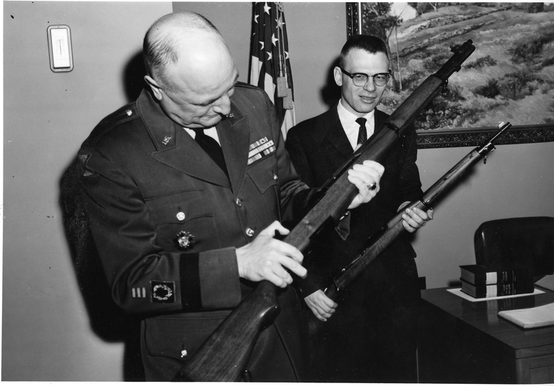 Gibson and Perry with rifles during Gibson's visit to the Truman ...