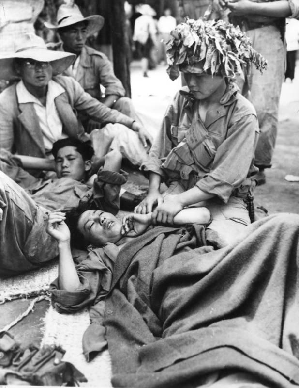 A South Korean soldier and a fellow wounded soldier | Harry S. Truman