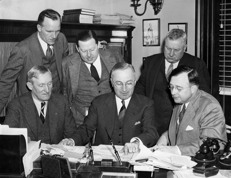 Senator Truman at his desk with others | Harry S. Truman