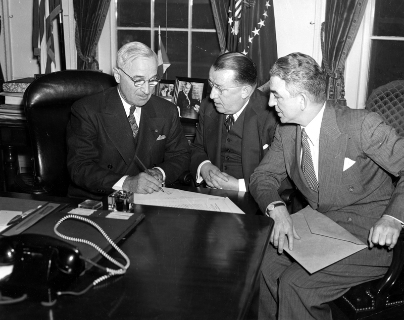 Truman signing S. 591 with Basil O'Connor and Howard Bonham | Harry S ...