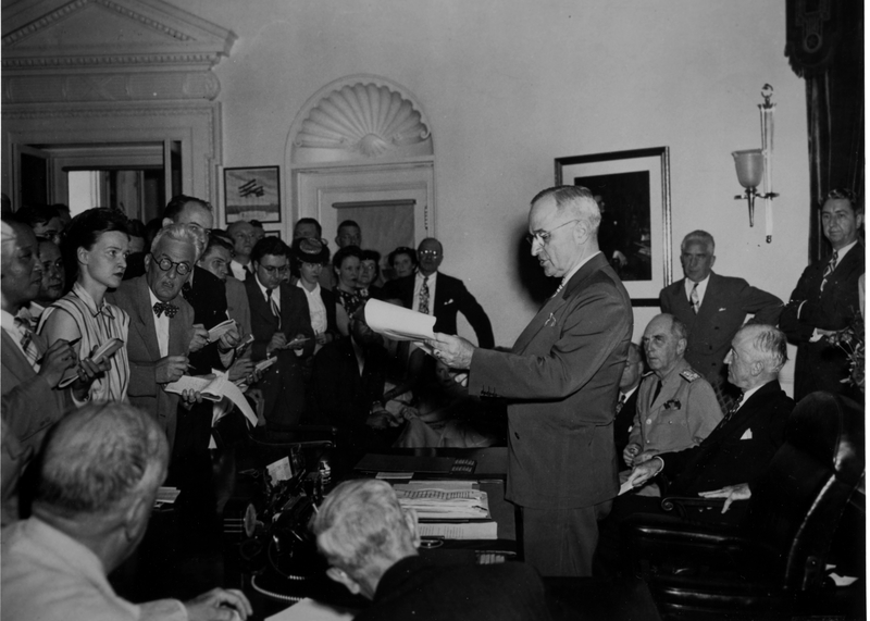 President Truman reading to the press his announcement of the Japanese ...