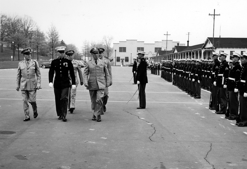 Officers reviewing formation of Marines at the U. S. Marine Base ...