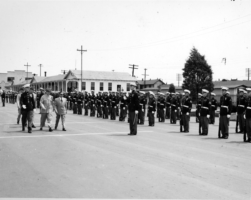 Officers reviewing formation of Marines at the U.S. Marine Base ...