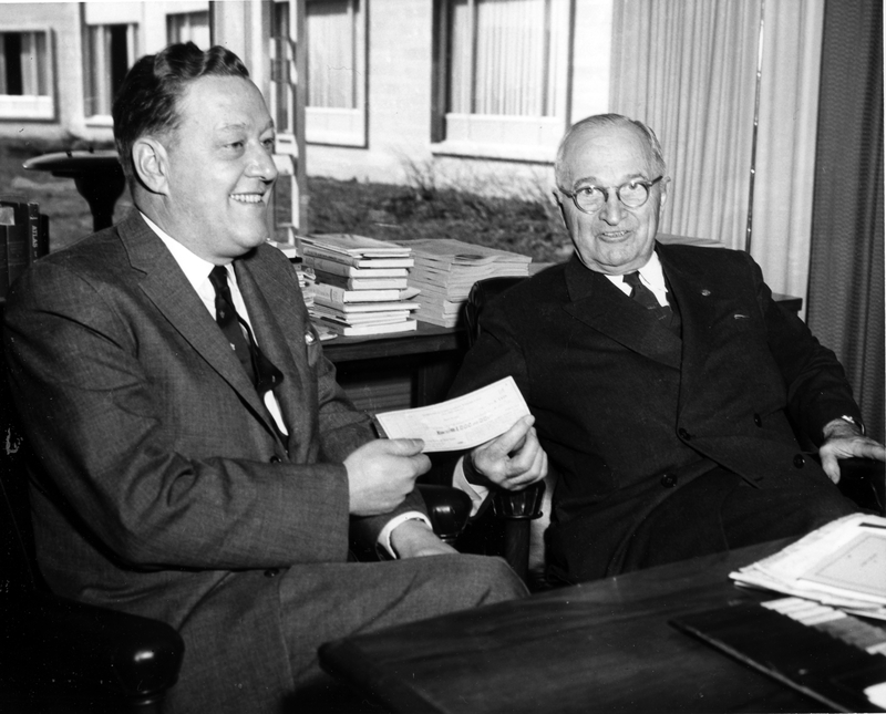 President Truman shown seated at his desk at the Truman Library ...
