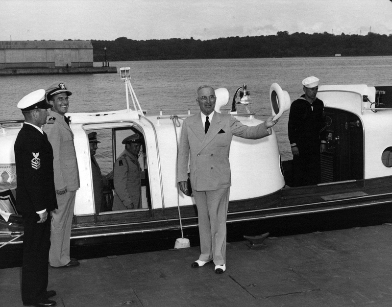President Harry S. Truman waving his hat as he is returning to the ...