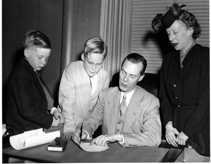 George V. Allen, Assistant Secretary of State, signing his official ...