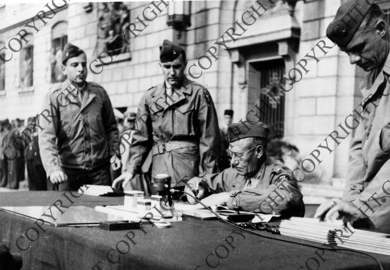 American officer signing documents in China | Harry S. Truman