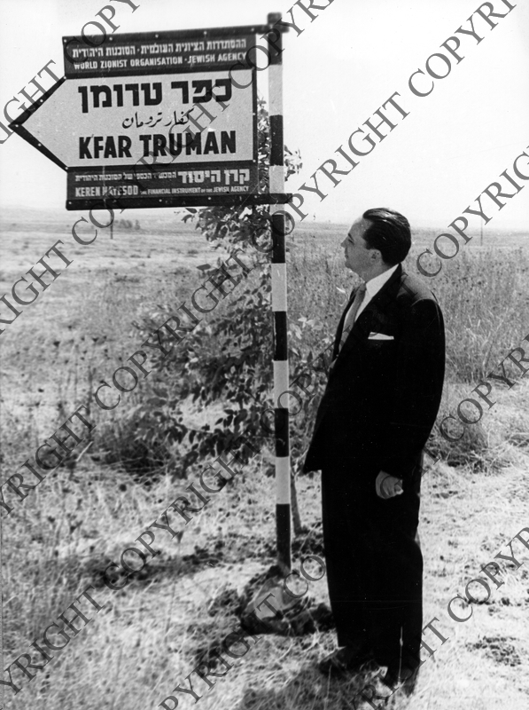 Bela Kornitzer and Sign Pointing to the "KFAR Truman" Kibbutz in Israel | Harry S. Truman