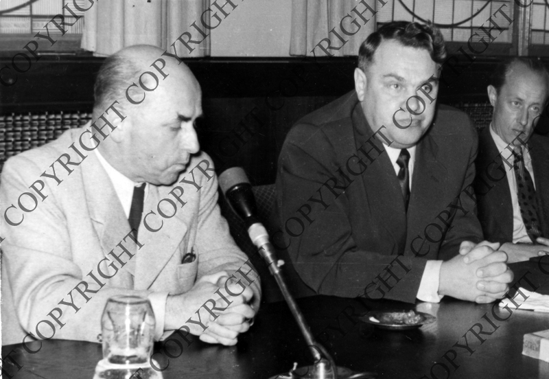 Three Unidentified Men Seated at Table | Harry S. Truman