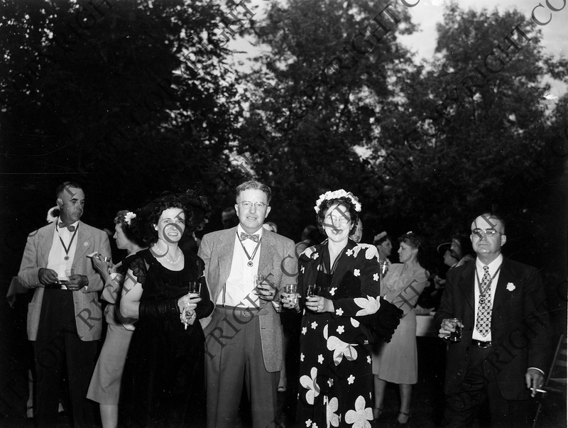 Three people smiling with drinks | Harry S. Truman