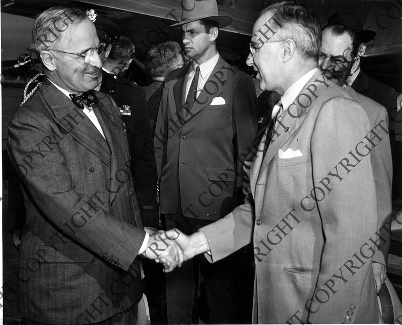President Truman shaking hands with unidentified man | Harry S. Truman