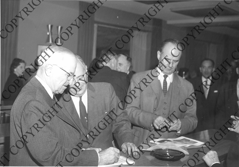 Former President Truman signing autograph for Truman Library guest ...