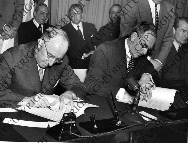 The U. S. and eight Atlantic Pact allies signed formal aid agreements ...
